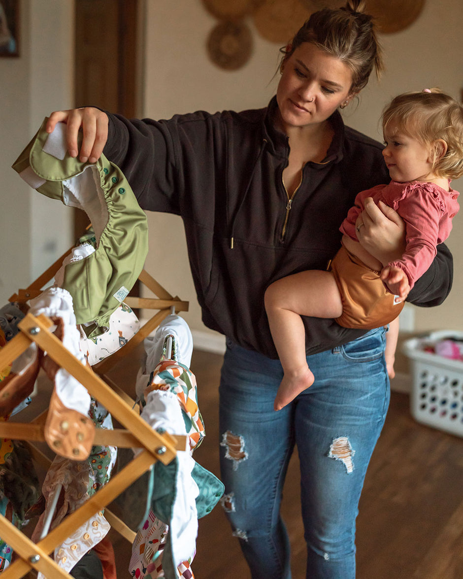How to use reusable cloth diapers including fit tips, washing advice ...